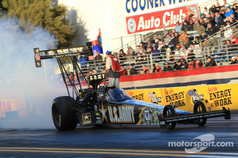 Tony Schumacher doing his burnout aboard his US Army Top Fuel Dragster ...